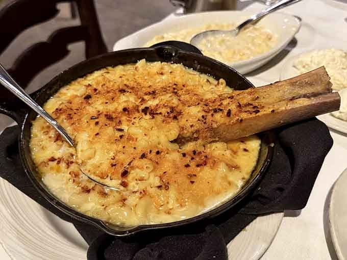 Mac and cheese arrives in a cast iron skillet because regular bowls are for regular restaurants.