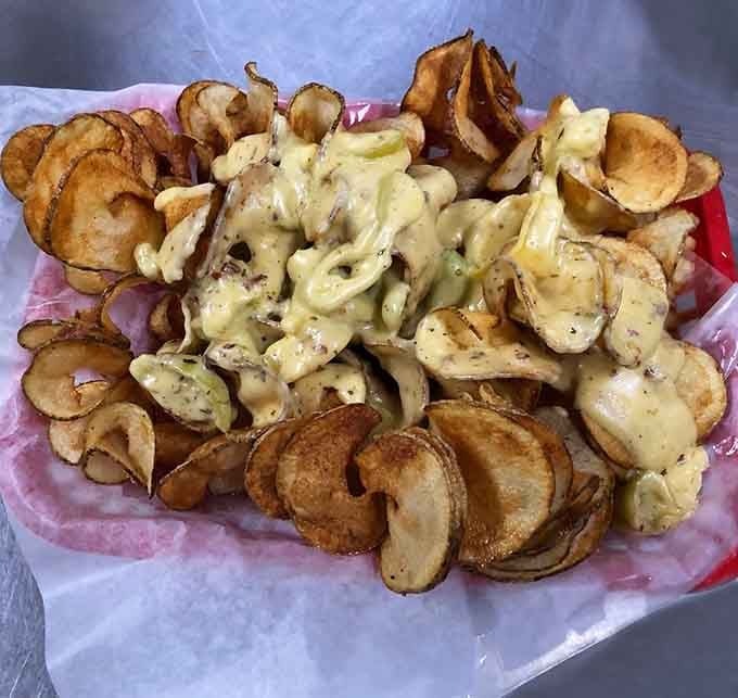 Volcano Potatoes erupt with creamy, cheesy goodness over crispy chips, creating the ultimate comfort food experience.