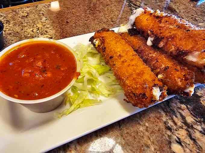 Golden, crispy mozzarella sticks that stretch like they're auditioning for a cheese commercial every single time.