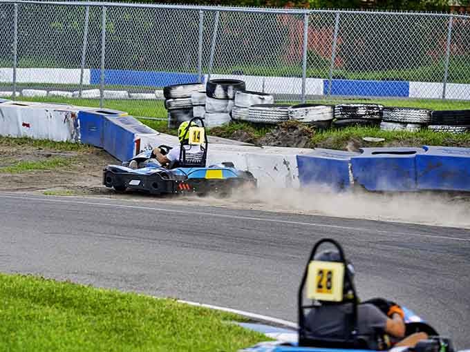 Dust flies as kart number 44 slides through the turn, proving that controlled chaos is part of racing's appeal.