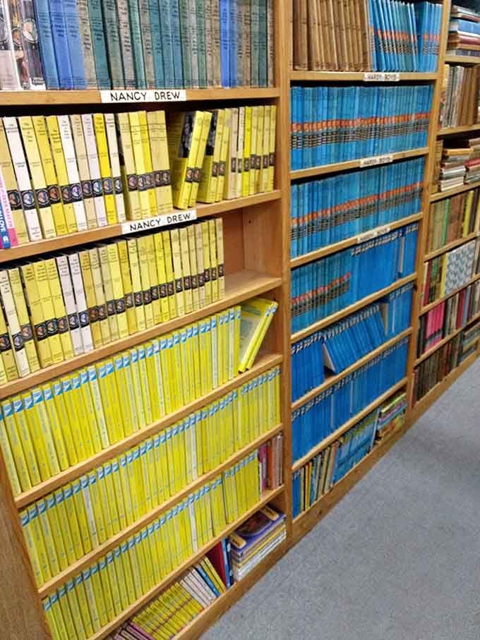 Nancy Drew's yellow spines line up like sunshine on a shelf, ready to solve mysteries for another generation.
