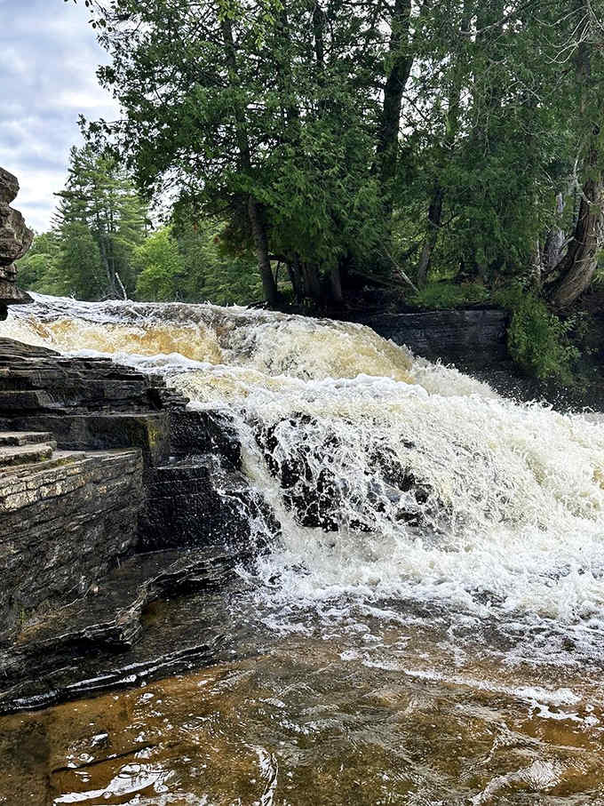 The Lower Falls may be smaller, but they pack plenty of punch with their amber-tinted cascades and rocky character.