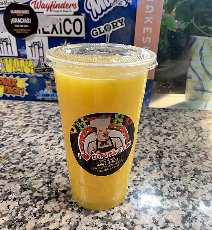 Fresh mango juice in a cup that's practically glowing&mdash;nature's candy in liquid form, no artificial anything required here.