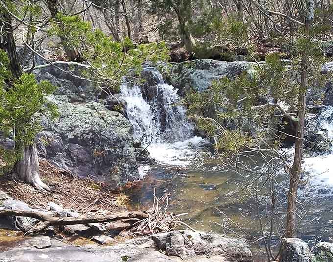 Mina Sauk Falls cascades gently over ancient stone, proving Missouri waterfalls have their own understated charm and beauty.