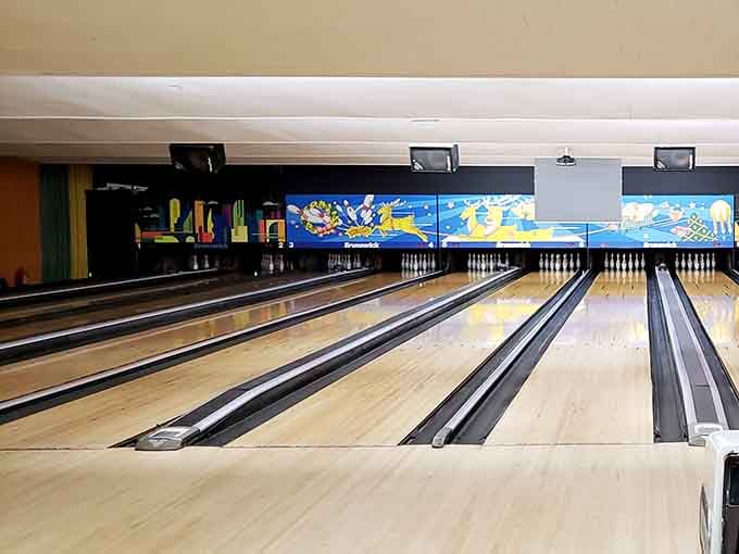 Bowling lanes gleaming under those lights, ready to humble your ego one gutter ball at a time.