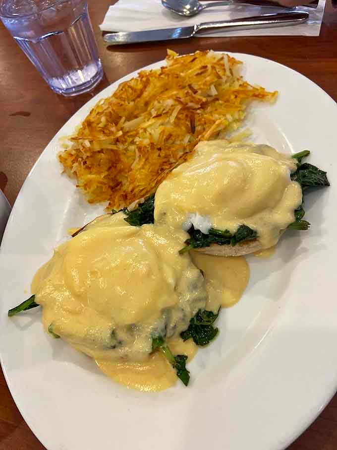 Eggs Benedict with hollandaise cascading over spinach: this is what Sunday mornings were invented for, friends.