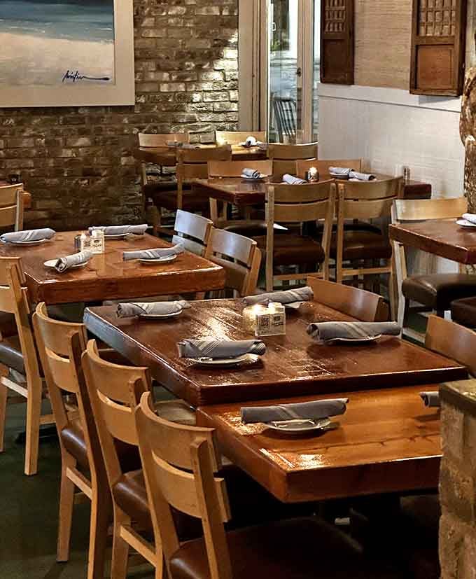 Wooden tables and beach paintings create an atmosphere where flip-flops feel just as appropriate as loafers.