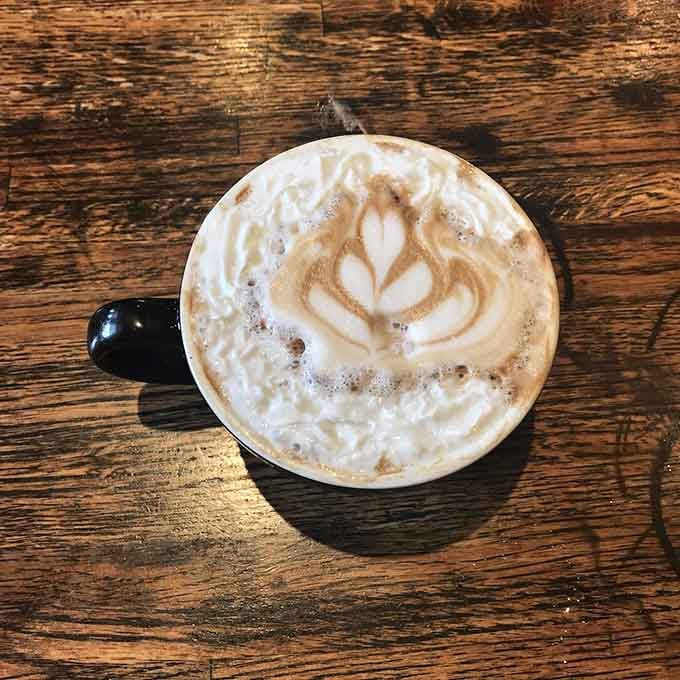 That latte art proves someone in this kitchen takes their craft seriously, even down to your morning caffeine.