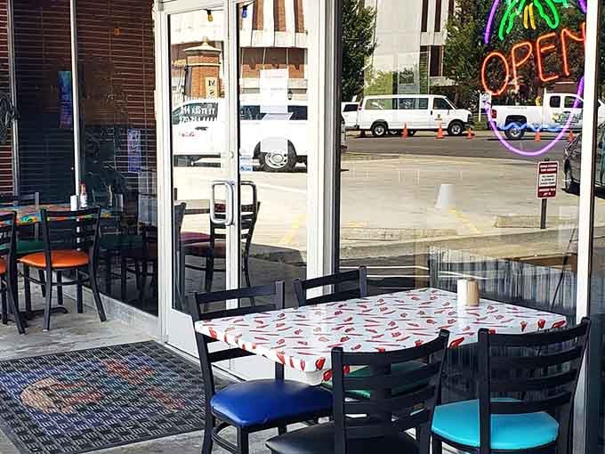 Colorful tables visible through the windows promise that eating here will be anything but a boring, beige experience today.