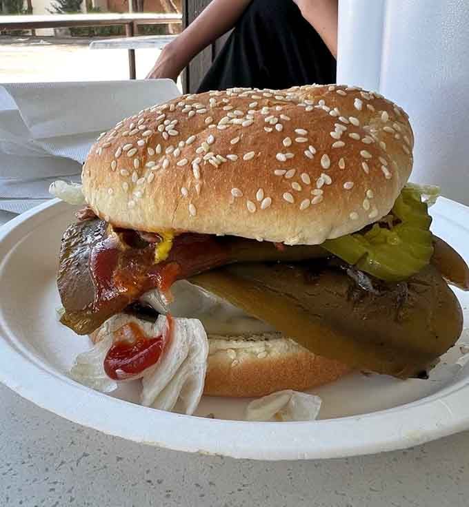 When pickles and bacon meet charcoal-grilled beef, magic happens on a bun with sesame seeds.