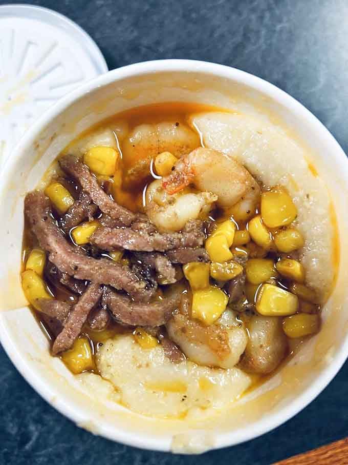Creamy grits topped with shrimp and corn create a Low Country classic that tastes like coastal Carolina mornings.