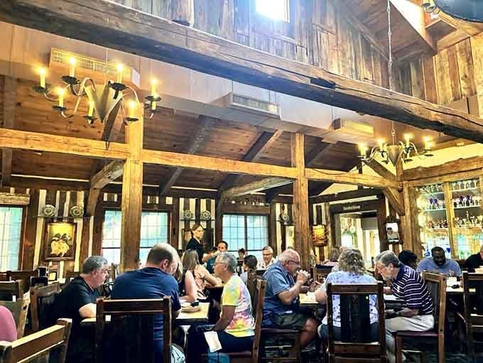 Diners enjoying their meals under soaring ceilings that make you feel simultaneously cozy and impressively important.
