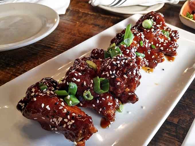 Chicken wings glazed to perfection, proving that sometimes the simplest pleasures are the most satisfying ones on the menu.