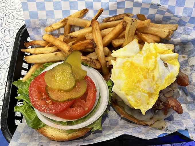 That burger towers higher than your expectations, with fries golden enough to make King Midas jealous about his career choice.