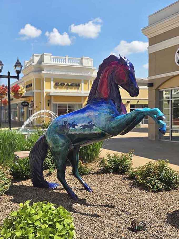This vibrant horse sculpture celebrates Kentucky's equestrian heritage while you celebrate finding designer deals nearby.