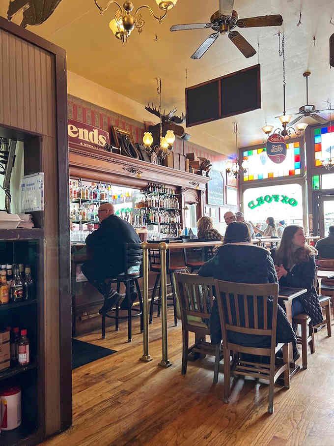 Locals gather at the bar where the drinks are cold and the company might include some unseen regulars.