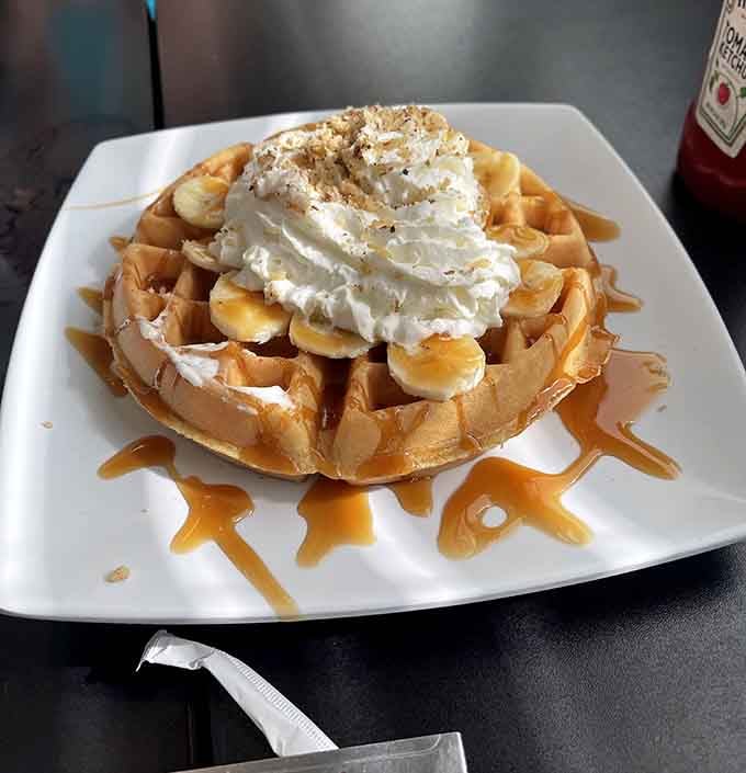 The Lumberjack Waffle: because someone decided breakfast needed hash browns, bacon, sausage, eggs, and gravy all at once.