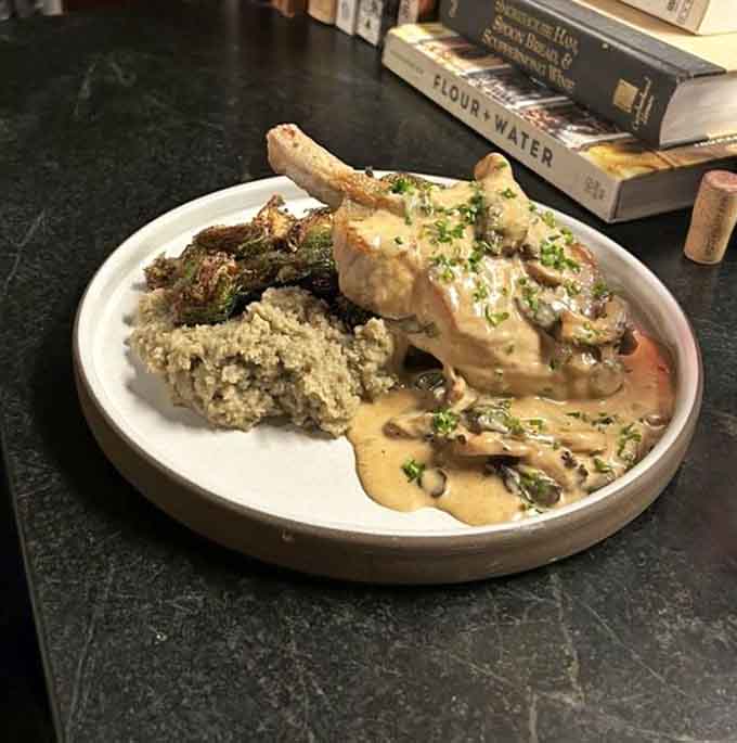This pork chop with mushroom sauce looks like Sunday dinner decided to dress up and go somewhere special.
