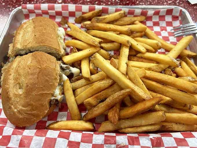 When your Philly cheesesteak comes with enough fries to share, but you absolutely won't be sharing them.