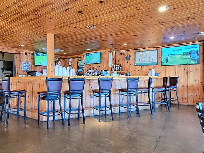 The bar area features wood ceiling, multiple screens, and that welcoming vibe that says "stay awhile, friend."
