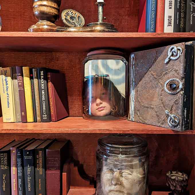 Heads in jars on bookshelves, because apparently someone took "getting lost in a good book" way too literally.