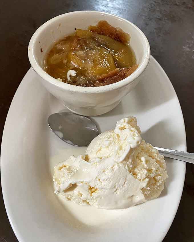 Warm peach cobbler with vanilla ice cream: the dessert that makes you understand why Georgia's the Peach State.