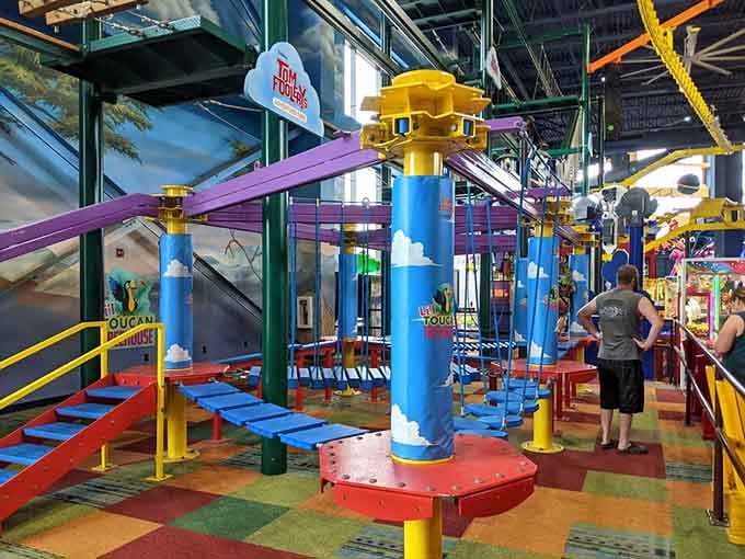 That colorful ropes course dangling overhead is where bravery gets tested and bragging rights are earned, one wobbly step at a time.