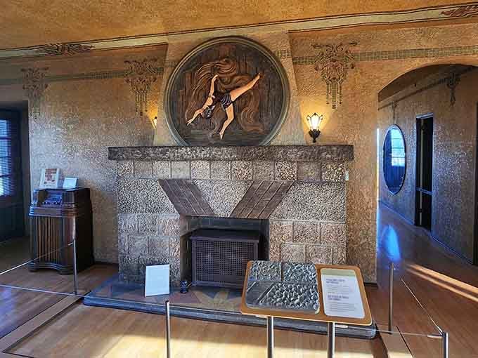 The fireplace anchors a room where desert elegance meets old-world craftsmanship in perfect harmony.