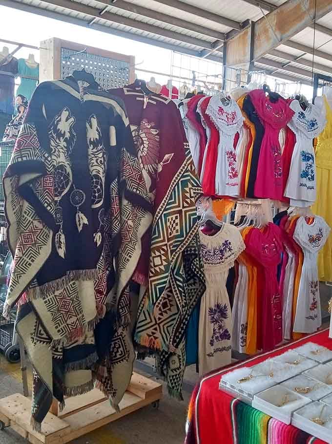 Traditional embroidered dresses and ponchos showcase the beautiful craftsmanship that makes shopping here feel like cultural exploration.
