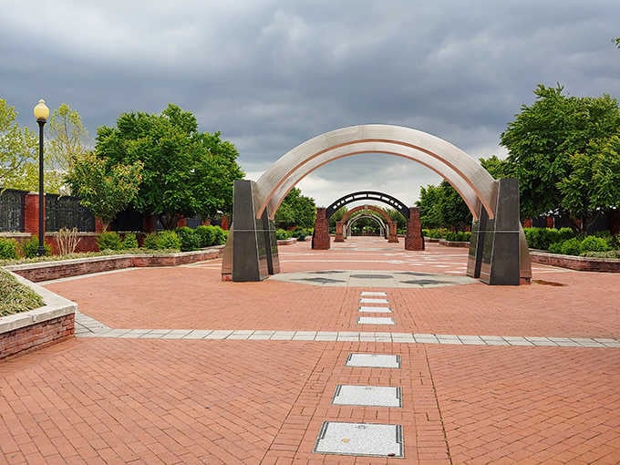Lalor Street Park's modern arches frame pathways where community gatherings happen without corporate sponsorship or admission fees.