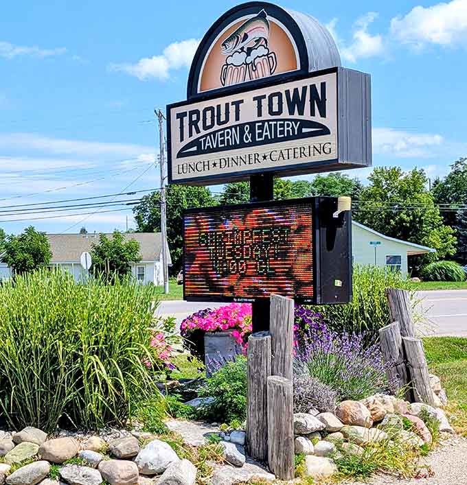 The roadside sign announcing your arrival at Kalkaska's best-kept culinary secret and smokehouse destination.