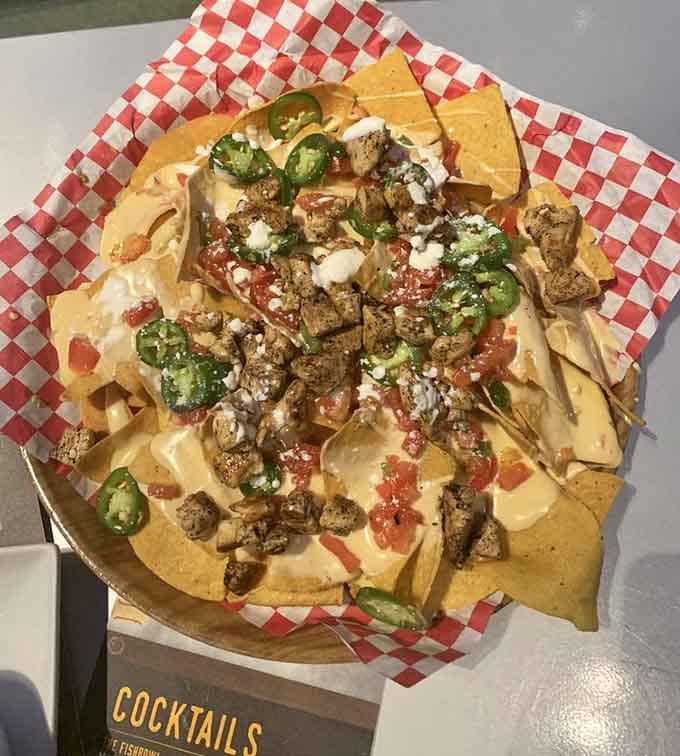Nachos piled high enough to feed your entire lane, because sharing is caring when you're losing badly.