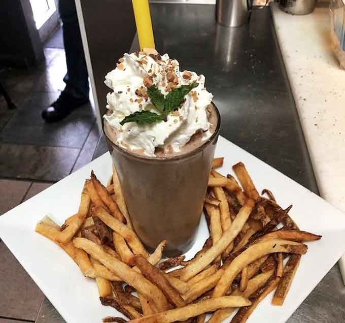A Guinness milkshake surrounded by crispy fries is either genius or madness, possibly both at once.