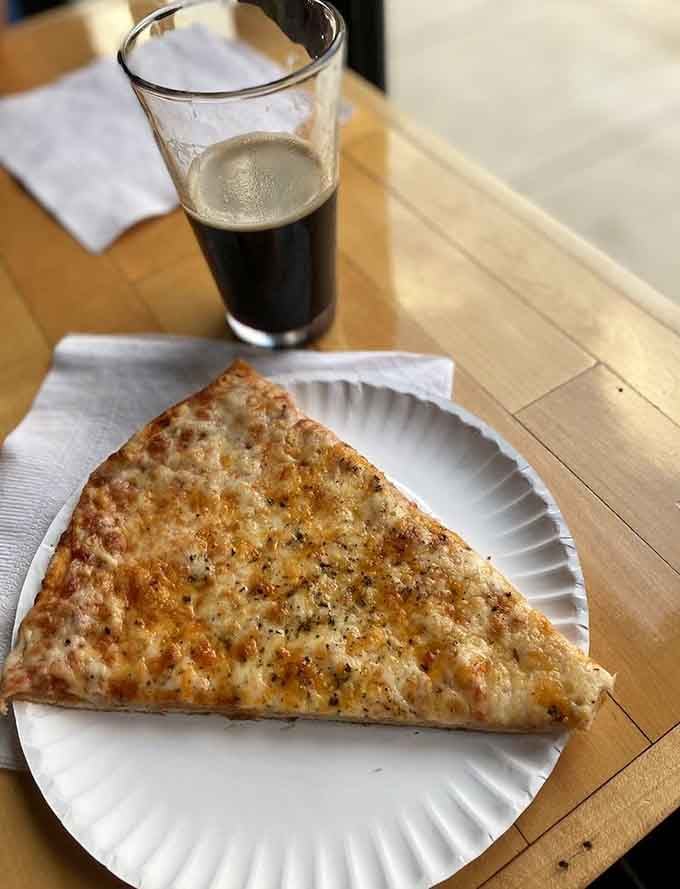 That cheese pizza slice looks exactly like what you need after losing three straight rounds of Street Fighter to a stranger.