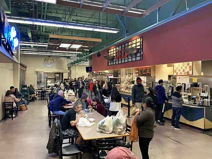 The food court where strangers become friends over shared tables and even better shared culinary discoveries.