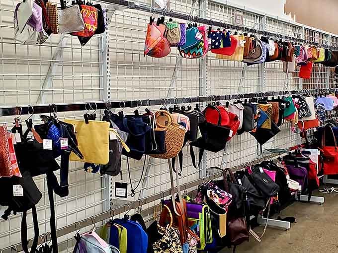 Handbags in every color hang like a rainbow of possibilities for your next great find.
