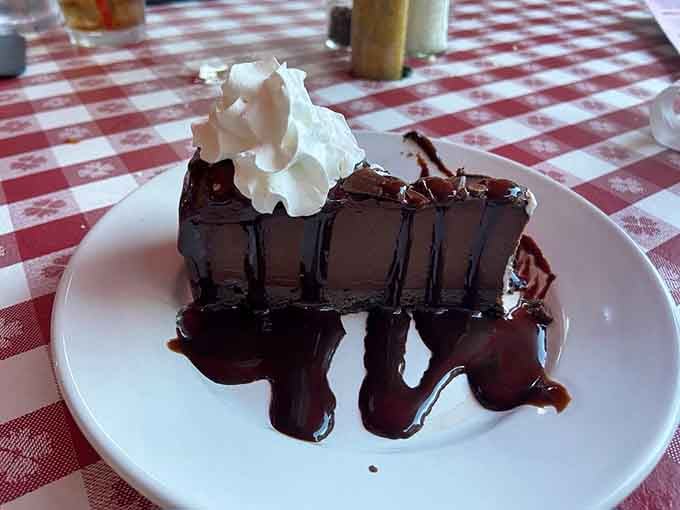 Chocolate cake drizzled with enough fudge to make your dentist schedule an extra appointment for next month.