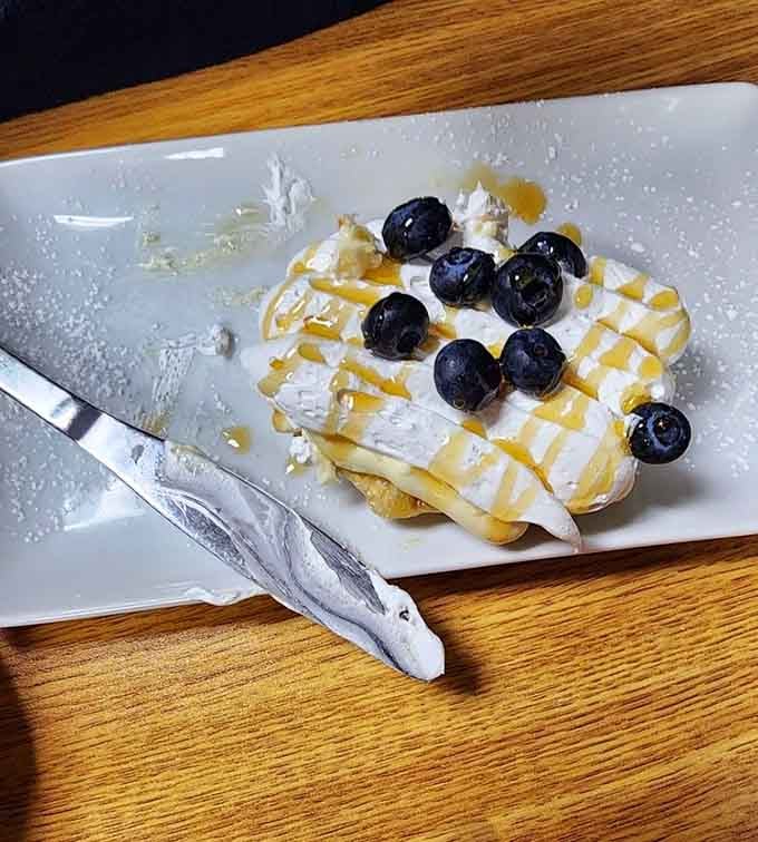 Blueberries crown this lemon cheesecake waffle like edible jewels, making ordinary breakfast seem downright boring by comparison.