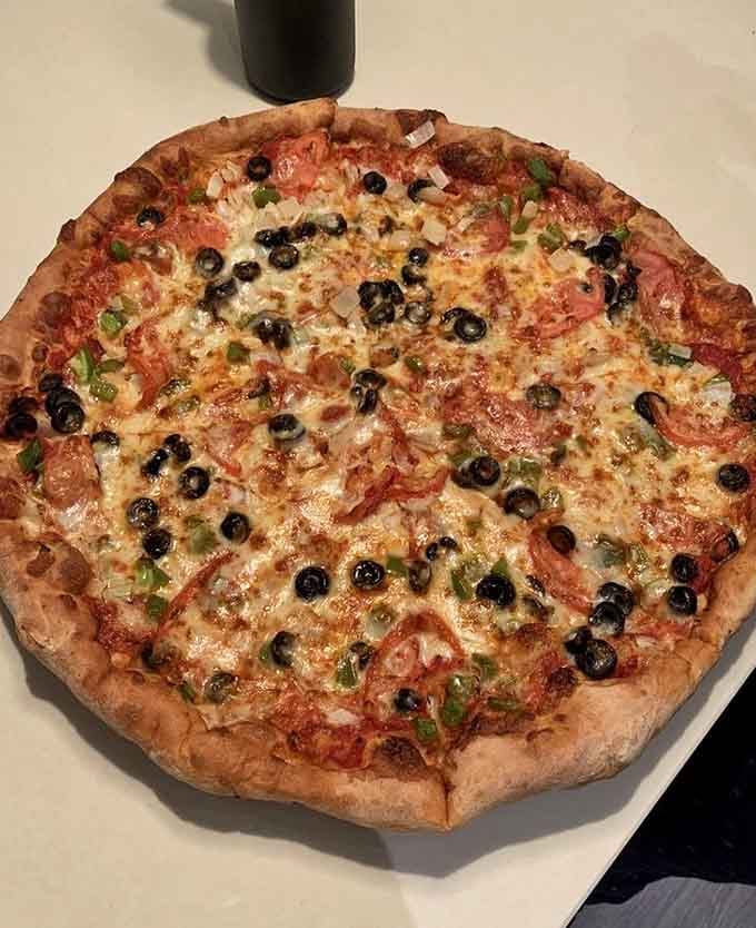 Colorful vegetables scattered across melted mozzarella prove that virtuous eating can still be absolutely delicious and satisfying.