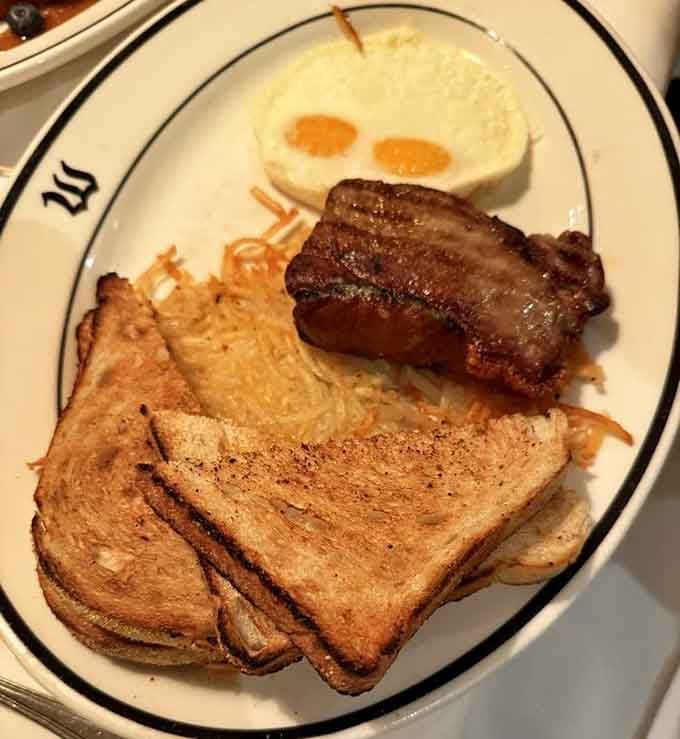 Steak and eggs with hash browns and toast, the breakfast of champions who know what real food tastes like.