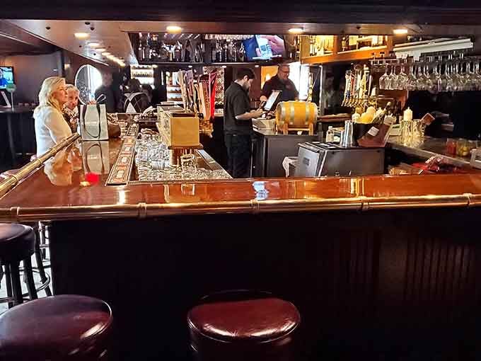 The polished bar gleams with possibility, backed by an impressive array of bottles and multiple screens for game day.