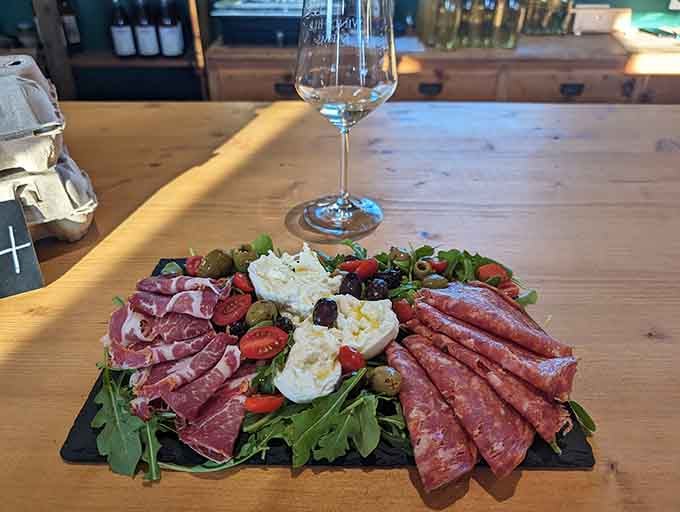 Fresh mozzarella, cured meats, and arugula arranged on slate makes you feel fancy without requiring a second mortgage.