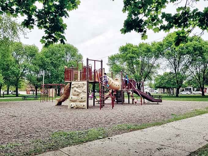Playgrounds where kids burn energy while parents contemplate the meaning of peaceful autumn afternoons.