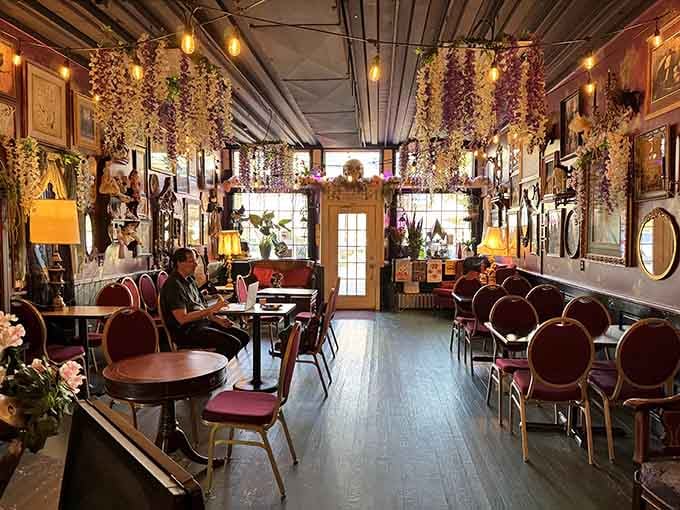 Hanging wisteria and vintage frames create an atmosphere where Stevie Nicks would feel right at home sipping espresso.