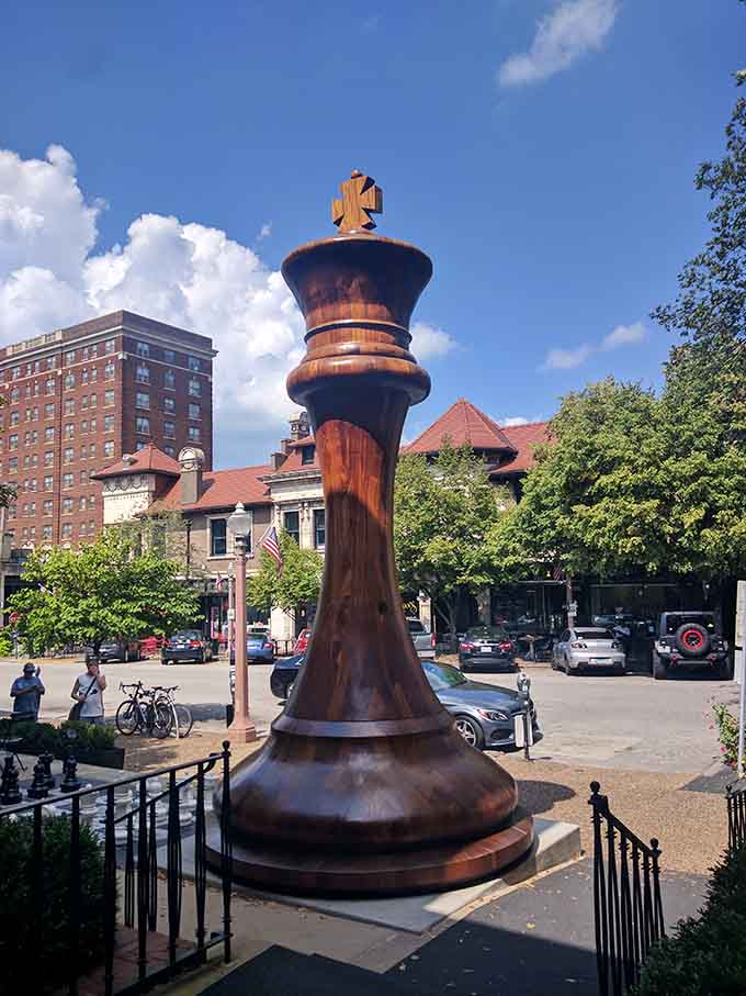 The giant king commands the plaza like a benevolent monarch watching over its checkered kingdom below.