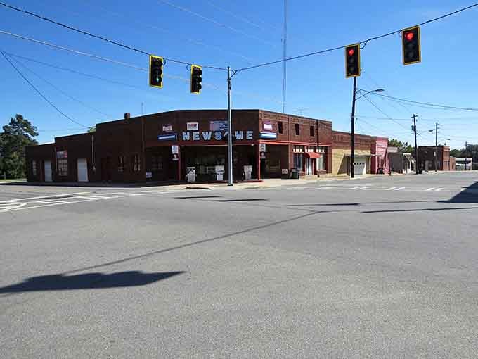 Corner storefronts bask in golden hour light, their weathered facades holding decades of handshakes and howdy-dos inside.