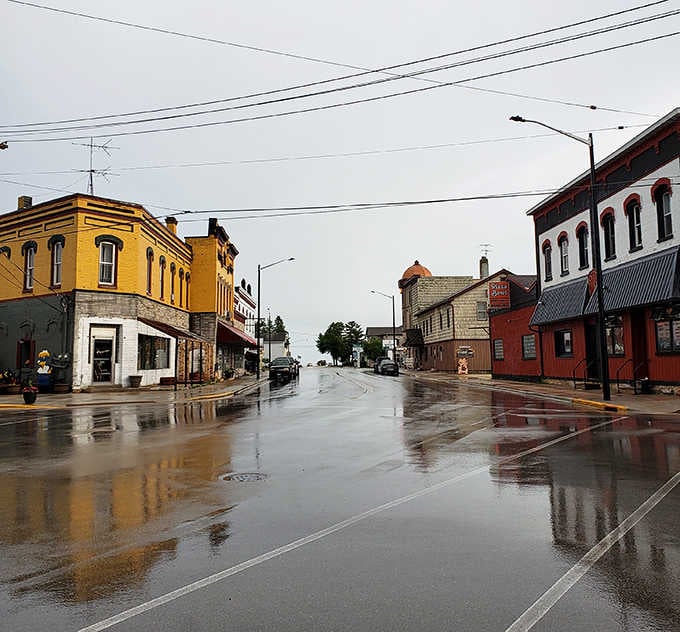 Rain-slicked streets reflect colorful buildings, turning an ordinary day into something painters dream about capturing on canvas perfectly.