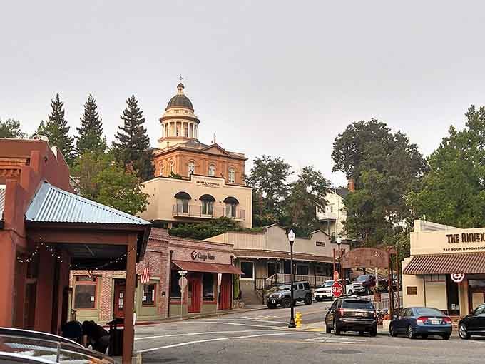 The courthouse dome glows golden at sunset, crowning this foothill town with unmistakable historic elegance and pride.