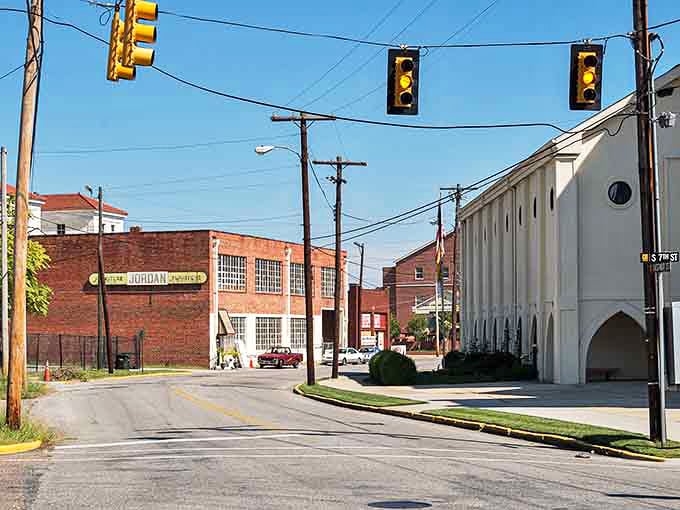 Industrial heritage meets small-town charm where brick warehouses stand alongside neighborhood streets waiting for new chapters.