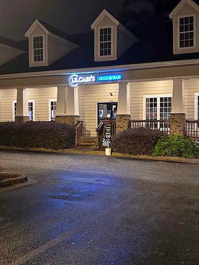 Those distinctive dormer windows and blue nighttime lighting give this suburban spot an upscale yet approachable neighborhood feel.